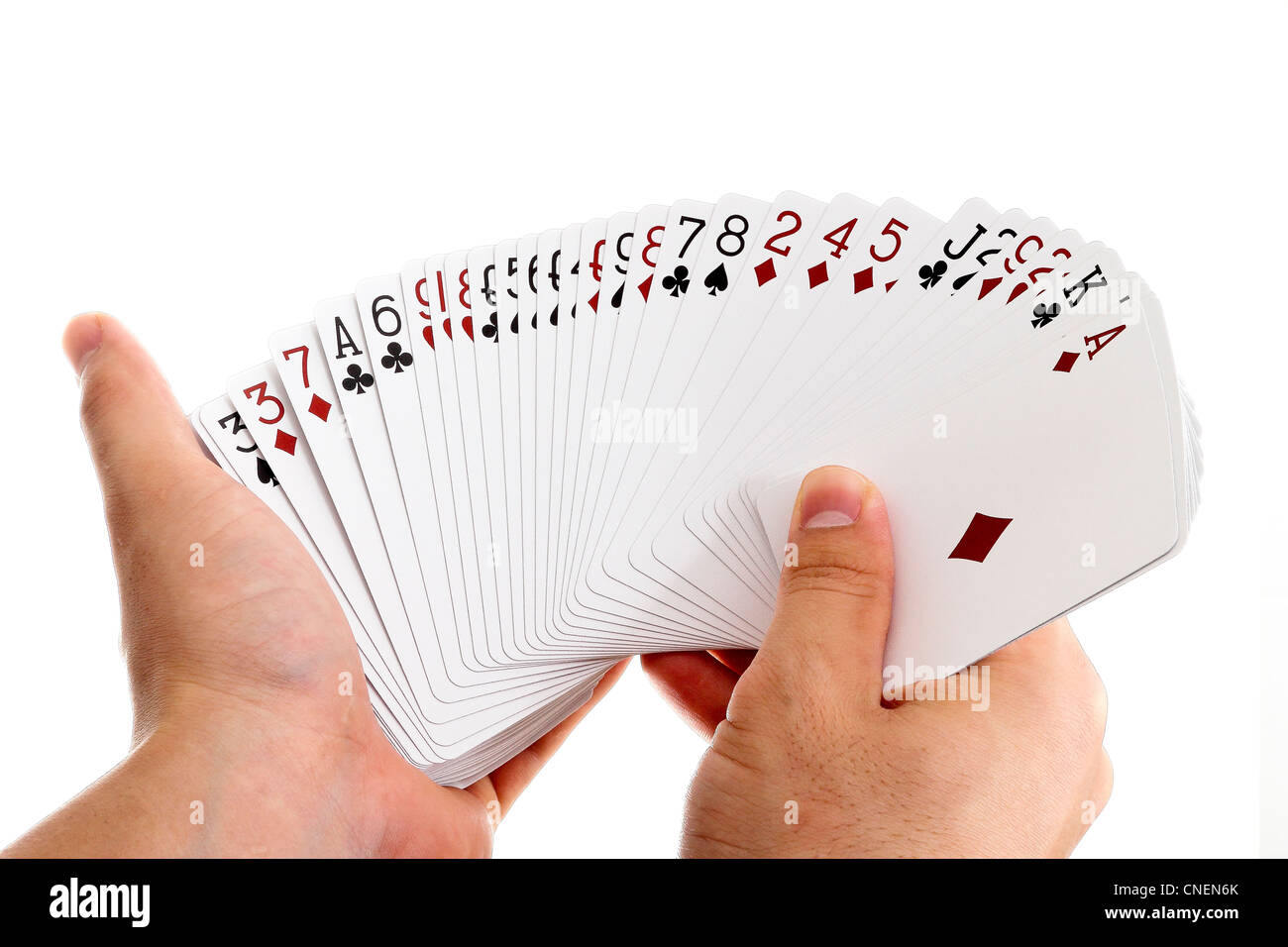 Playing cards in hand with fan spread Stock Photo - Alamy