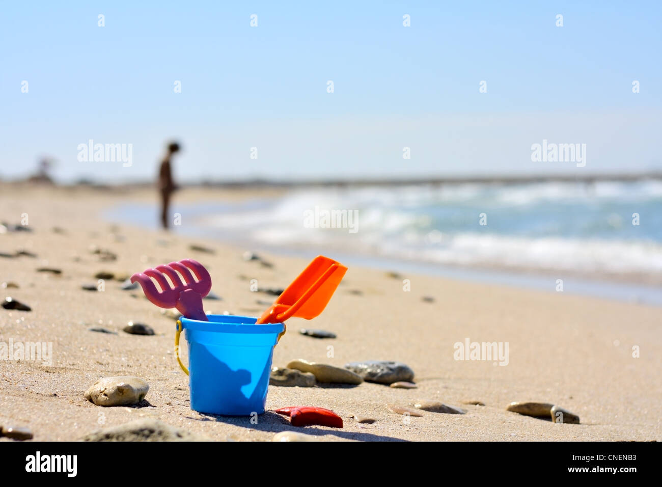 Plastic bucket on the beach near the sea Stock Photo - Alamy