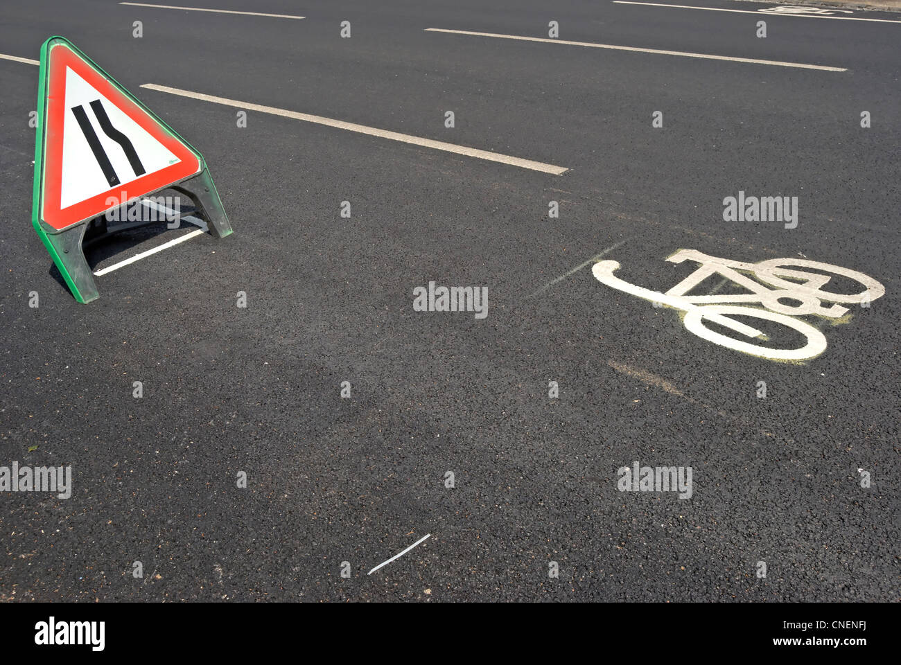 british road marking indicating a cycle lane and temporary sign ...
