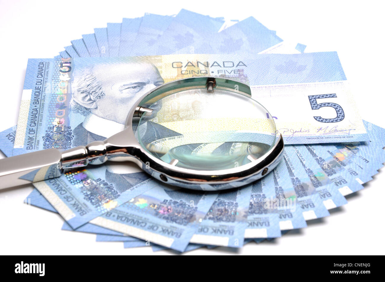 Money magnifier hi-res stock photography and images - Alamy