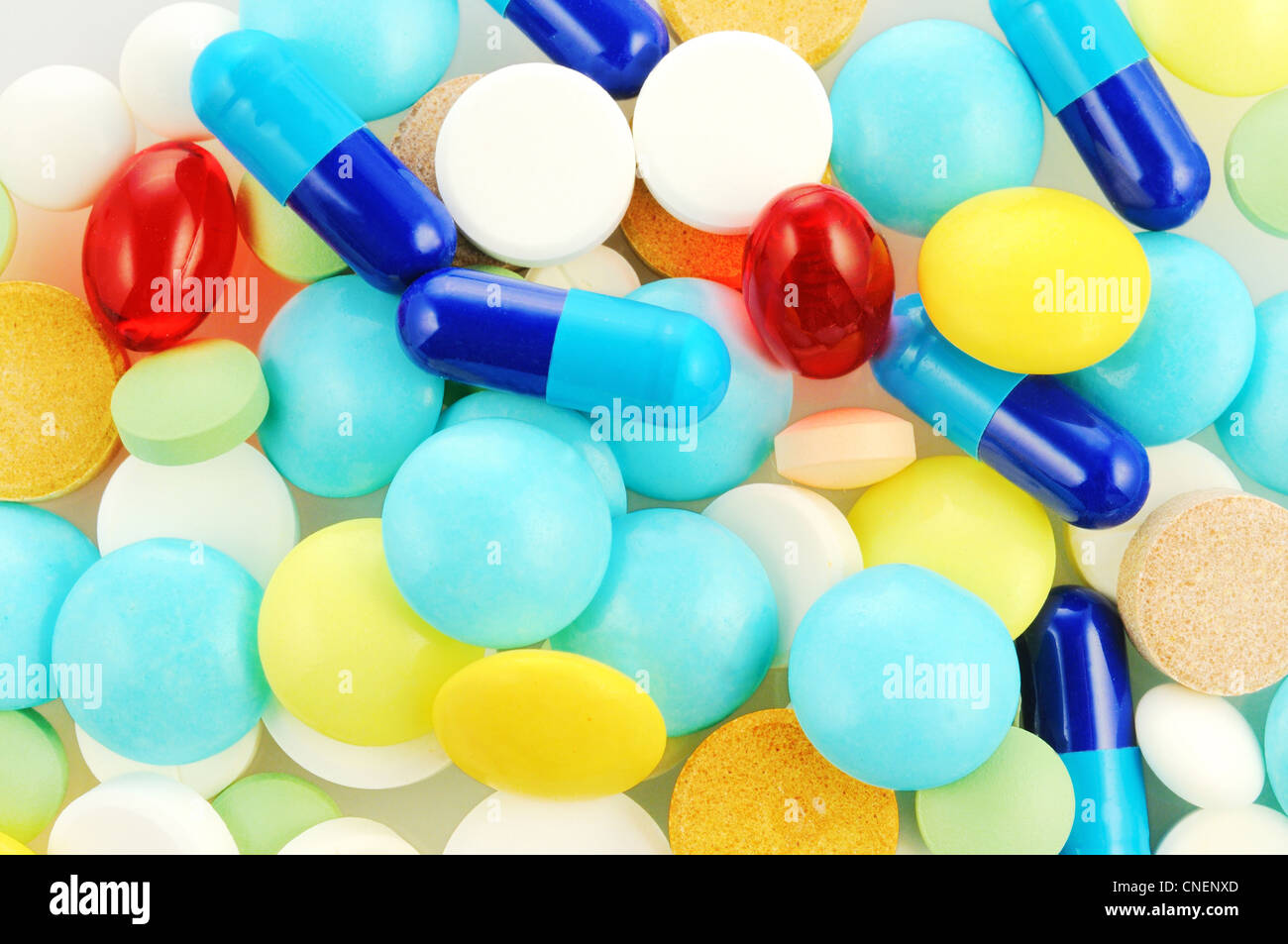 Background with different color tablets and pills Stock Photo - Alamy