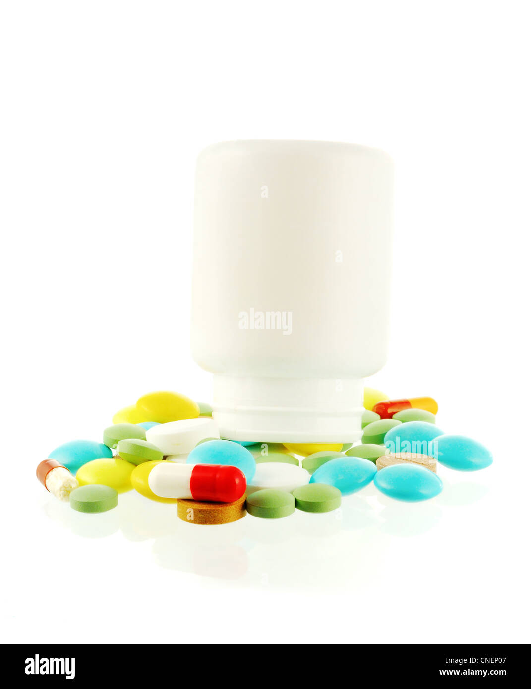 Bottle with falling out many colored pills on white background Stock ...