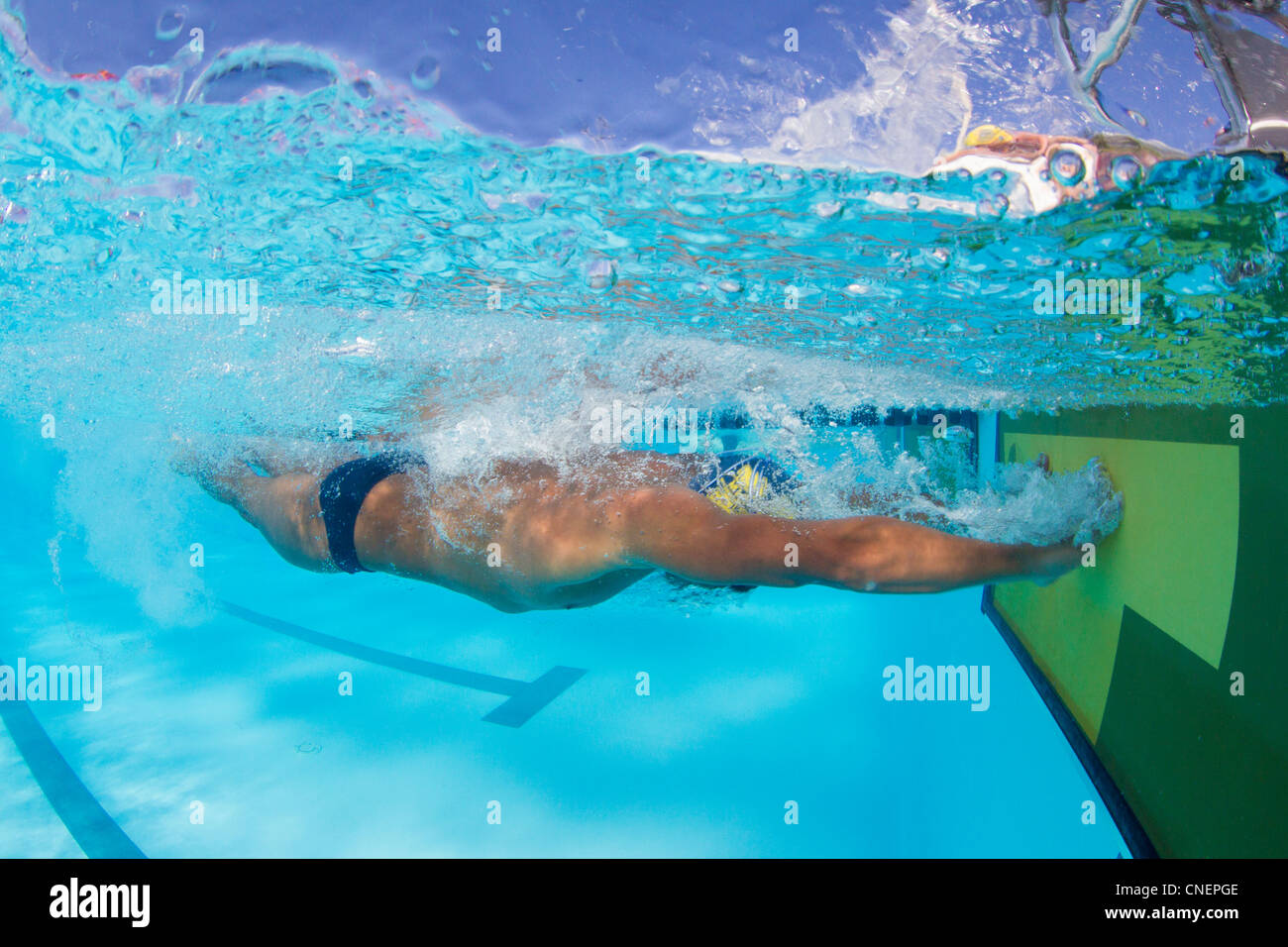 Competitive swimmer touches wall Stock Photo - Alamy