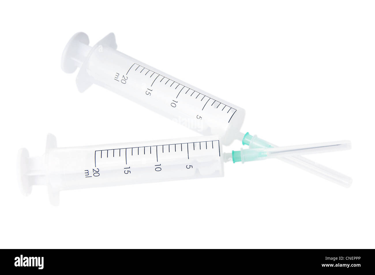 Two syringes with covered needles isolated on white background Stock ...