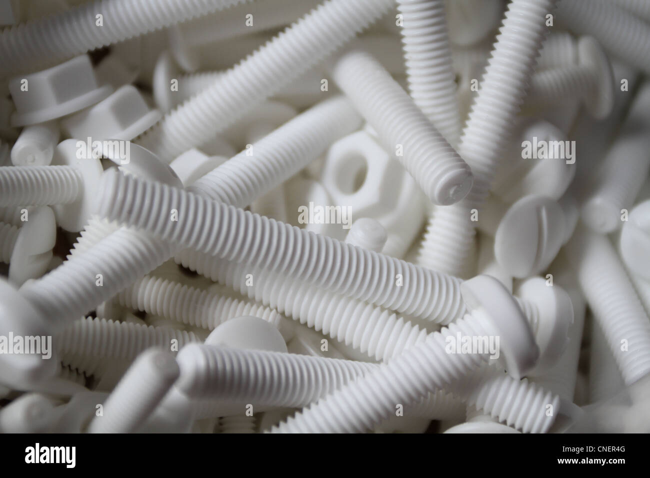 Plastic nuts and bolts Stock Photo - Alamy