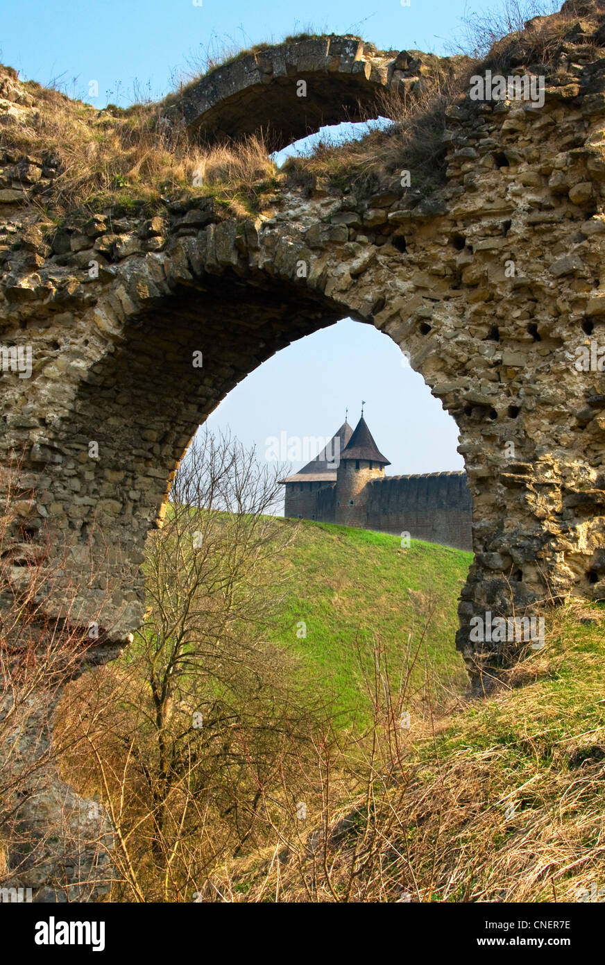 Two towers of ancient castle through old arch Stock Photo - Alamy