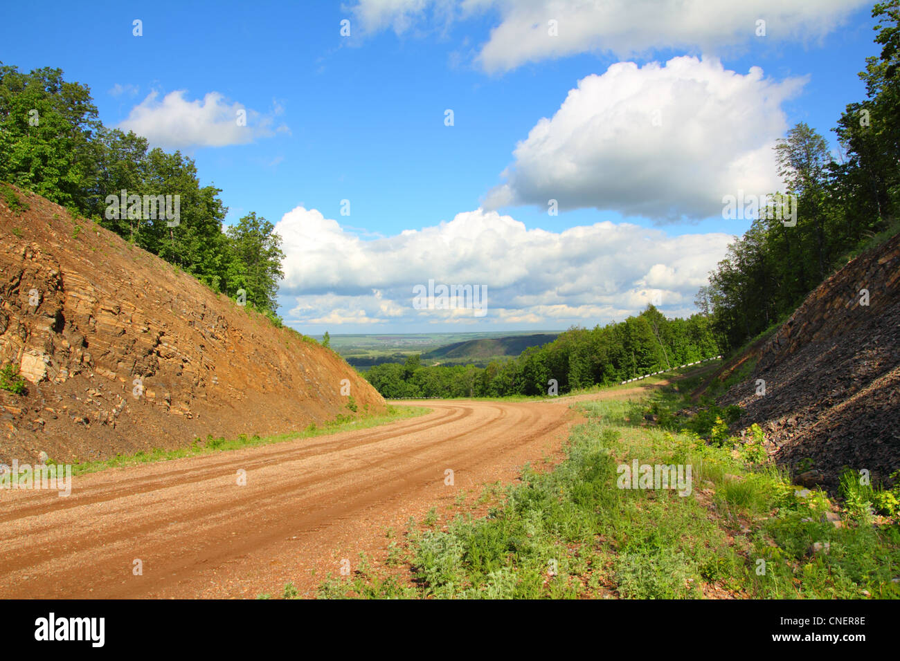 landscape with dirt road in mountains Stock Photo - Alamy