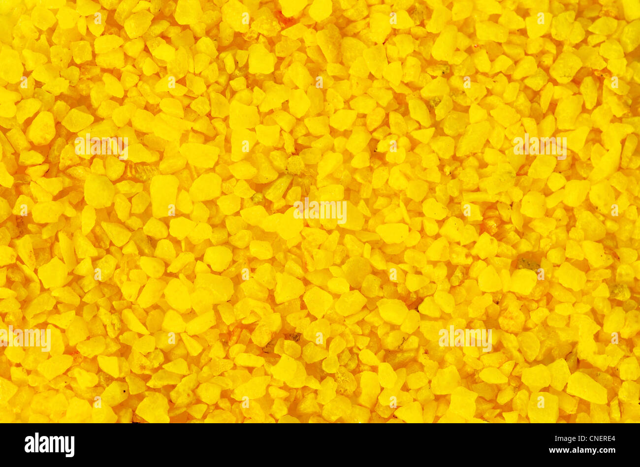 Rough small yellow stone background Stock Photo - Alamy