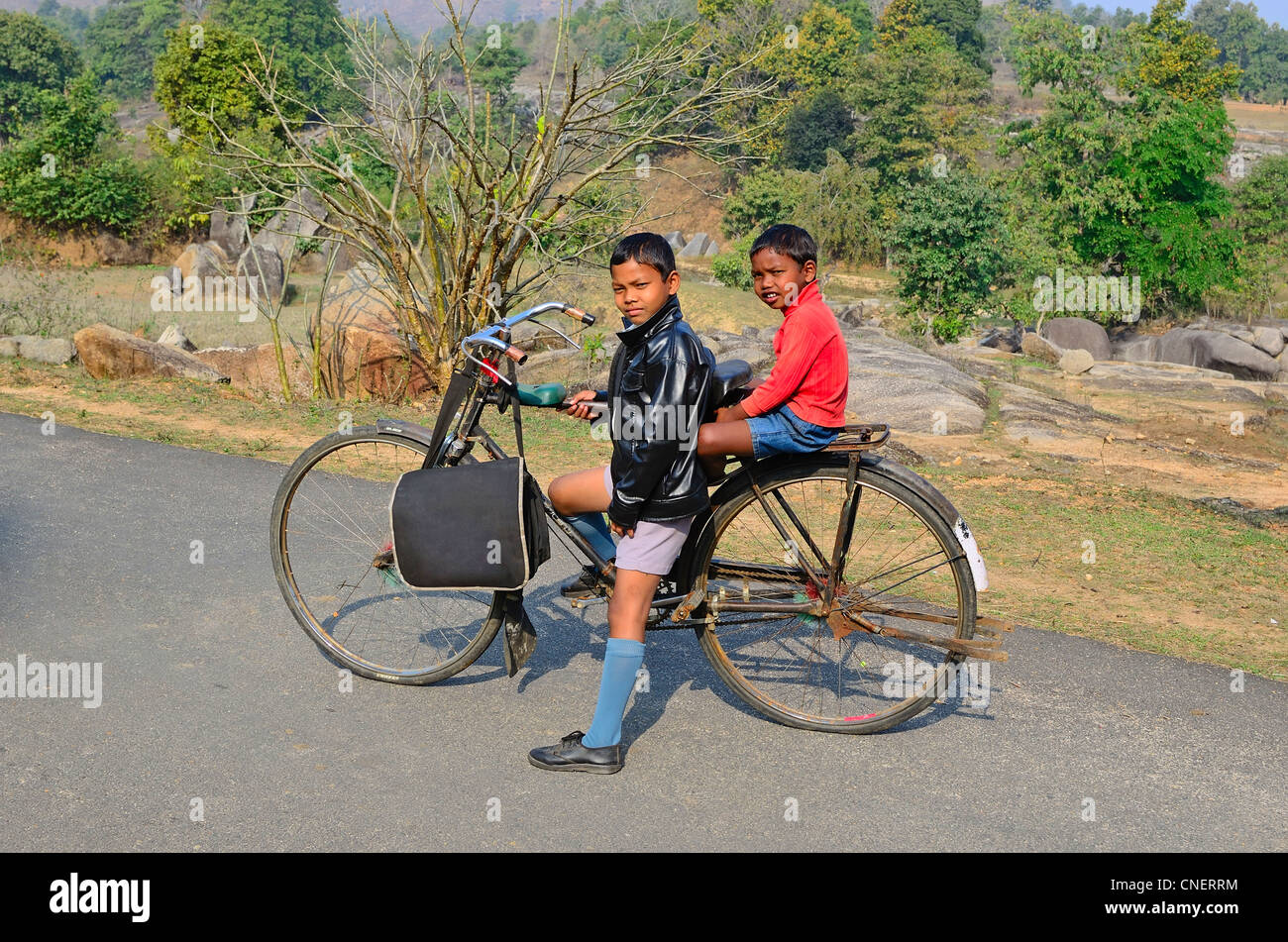 Two indian boys riding on bicycle Stock Photo - Alamy