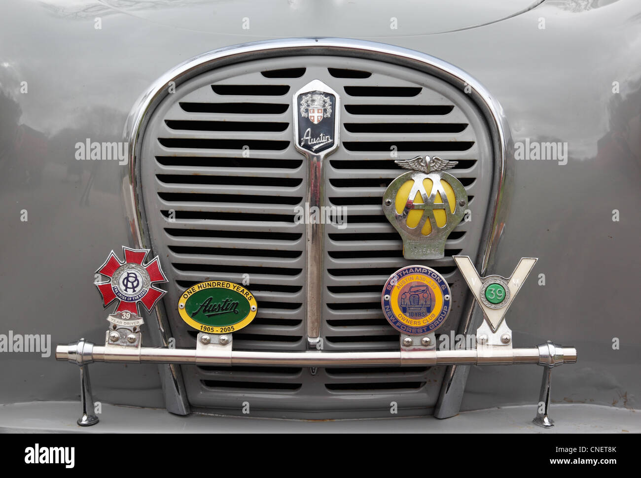 Close up of badges and the front grille of an Austin A35 classic car ...