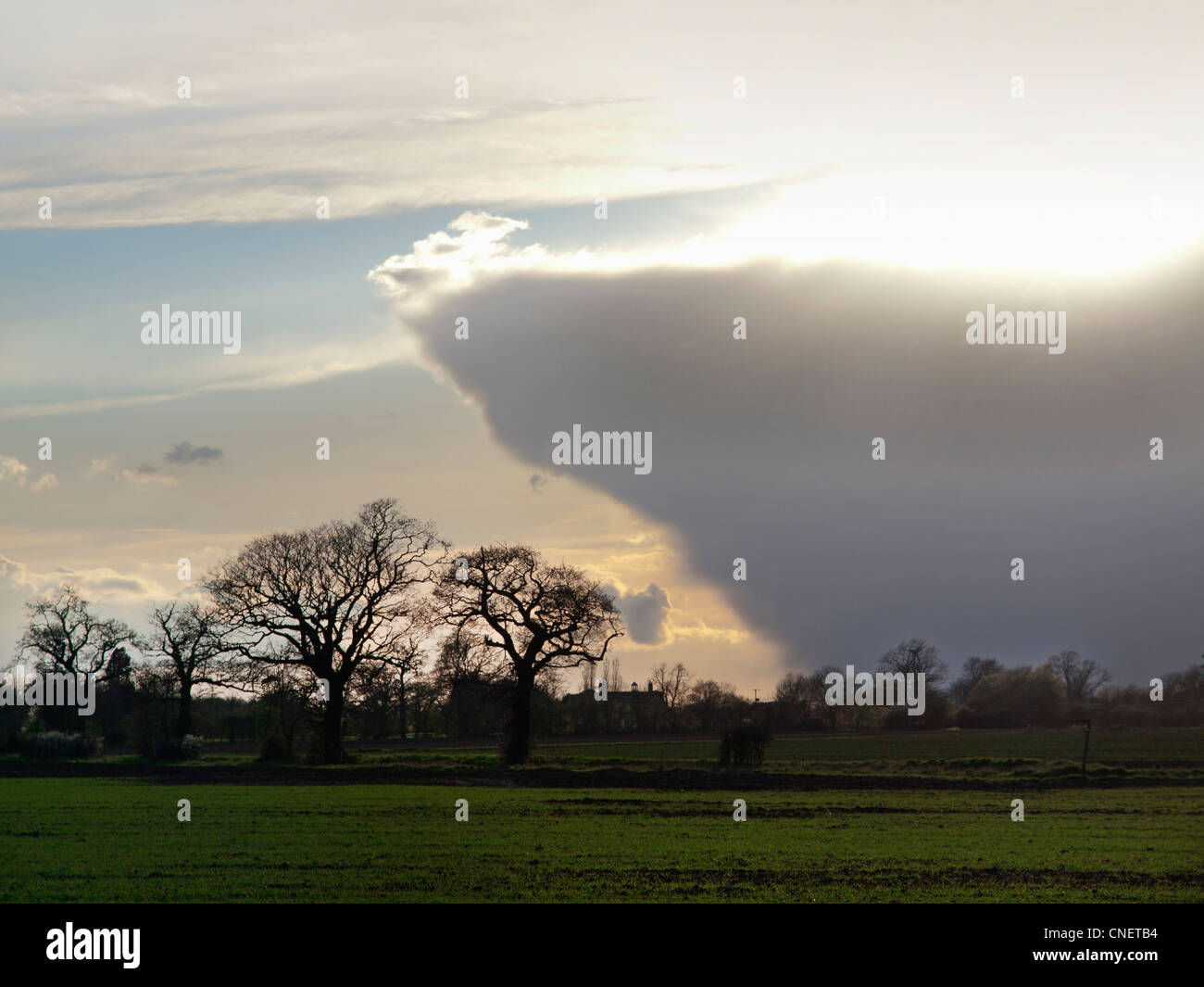 The Suffolk countryside beneath a strangely shaped cloud Stock Photo ...