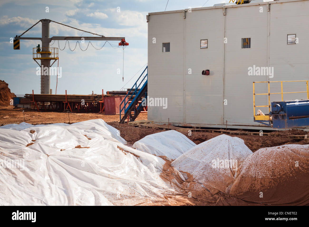The new drilling site with oil sludge barn Stock Photo - Alamy
