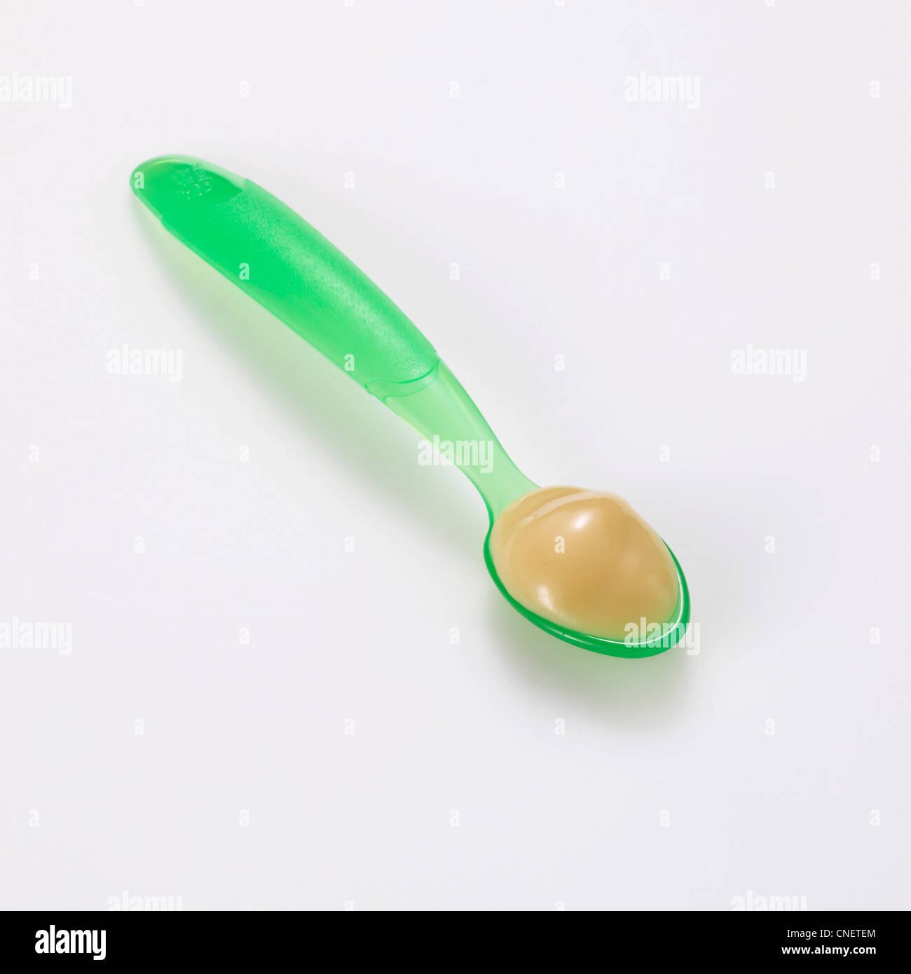 Green Plastic Spoon With Baby Food Stock Photo - Alamy