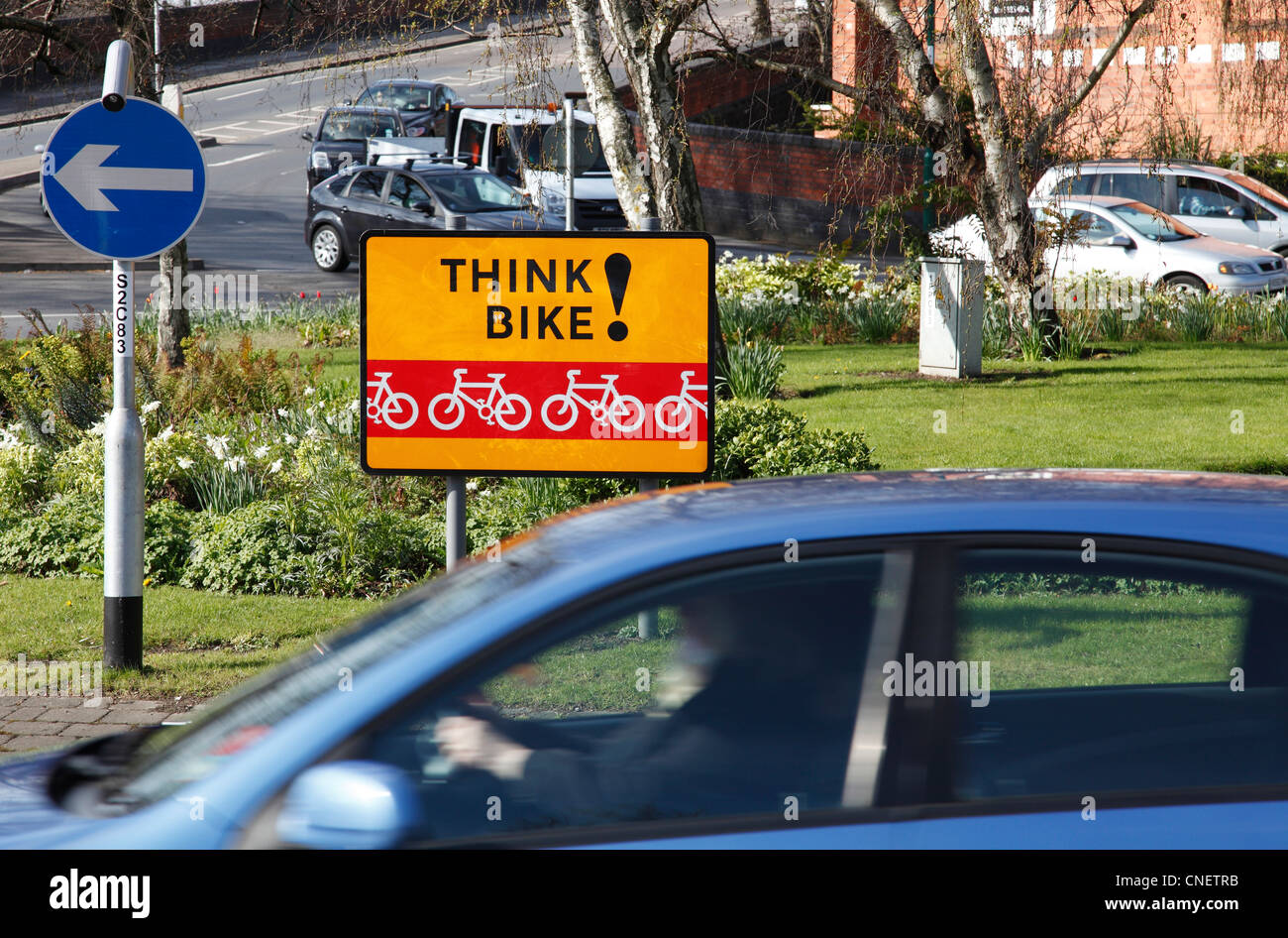 A Think Bike road safety sign on a busy road junction in the U.K Stock ...