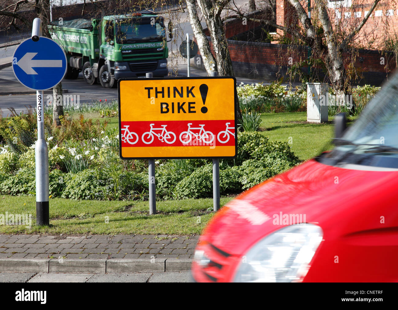 A Think Bike road safety sign on a busy road junction in the U.K Stock ...