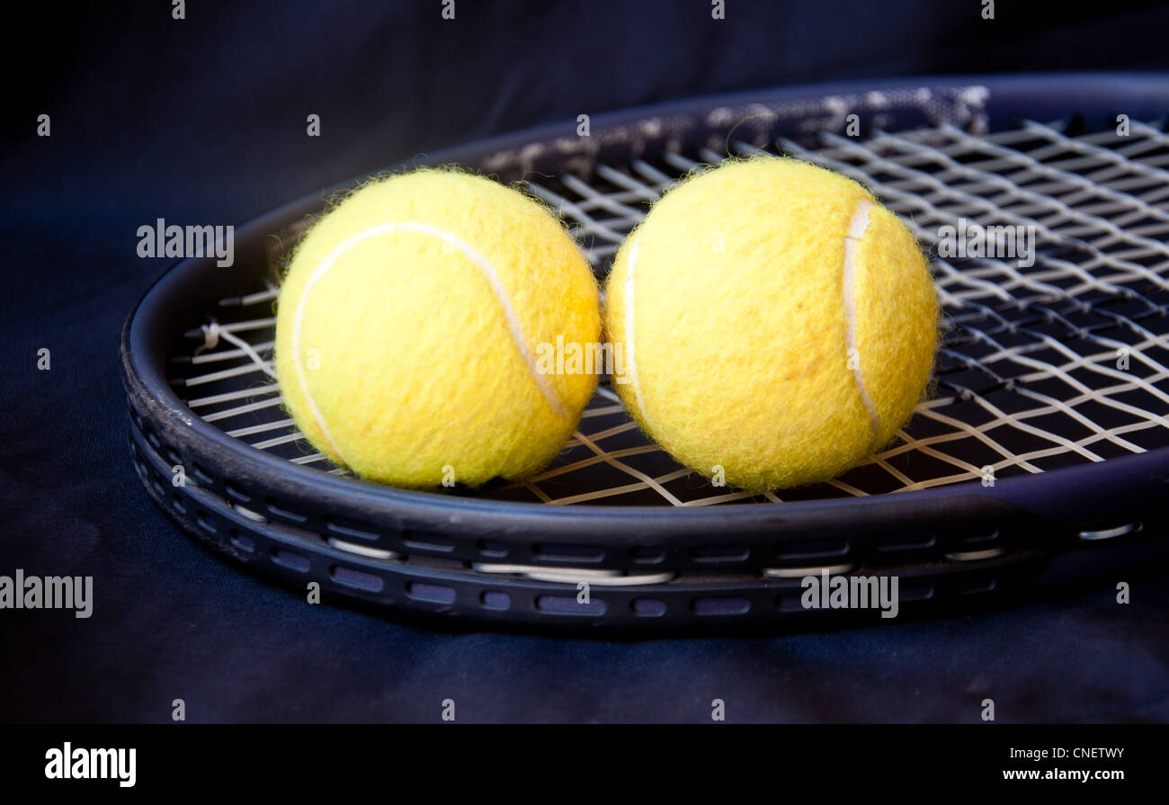 tennis ball on racket Stock Photo - Alamy