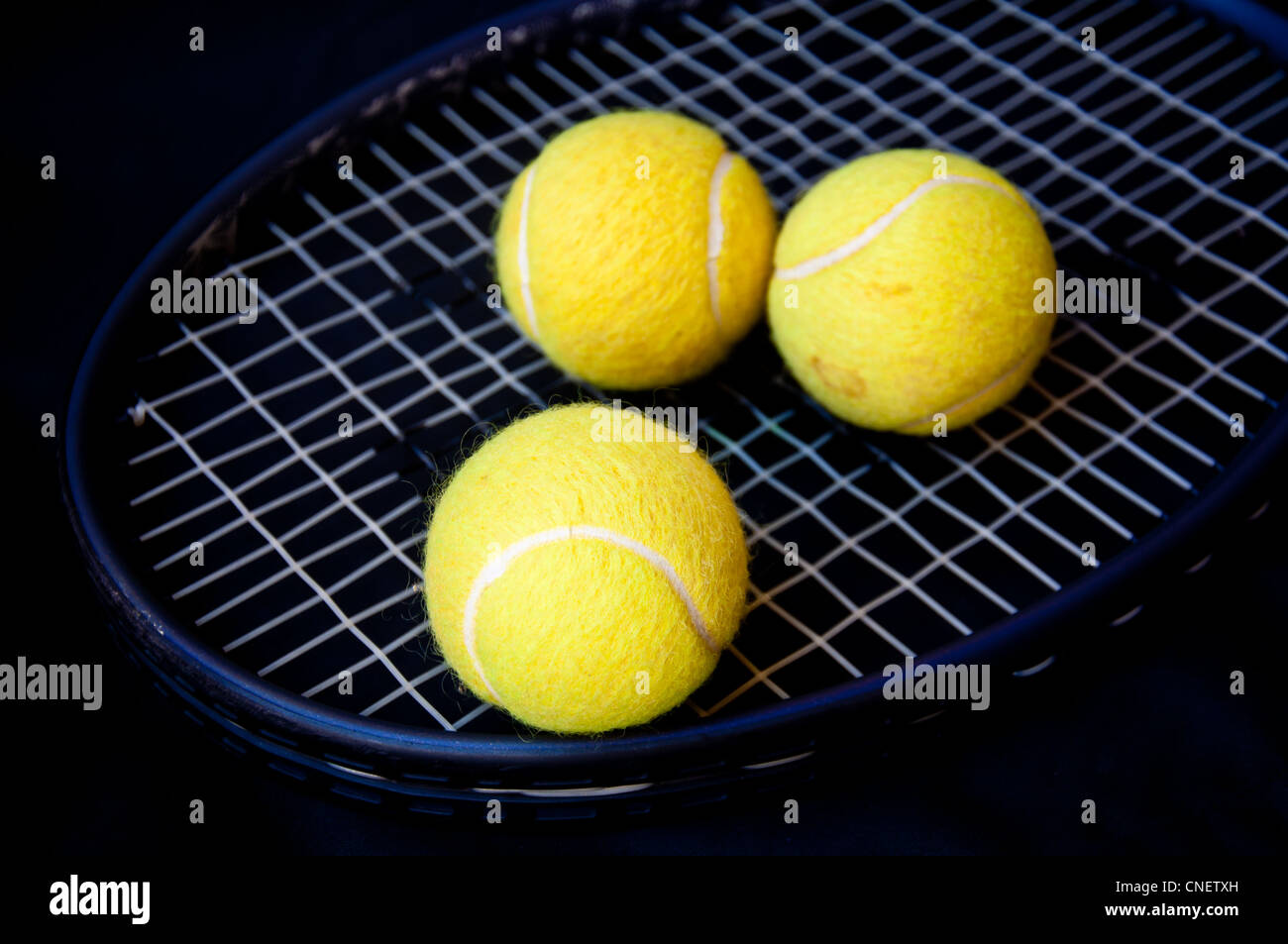 tennis ball on racket Stock Photo - Alamy