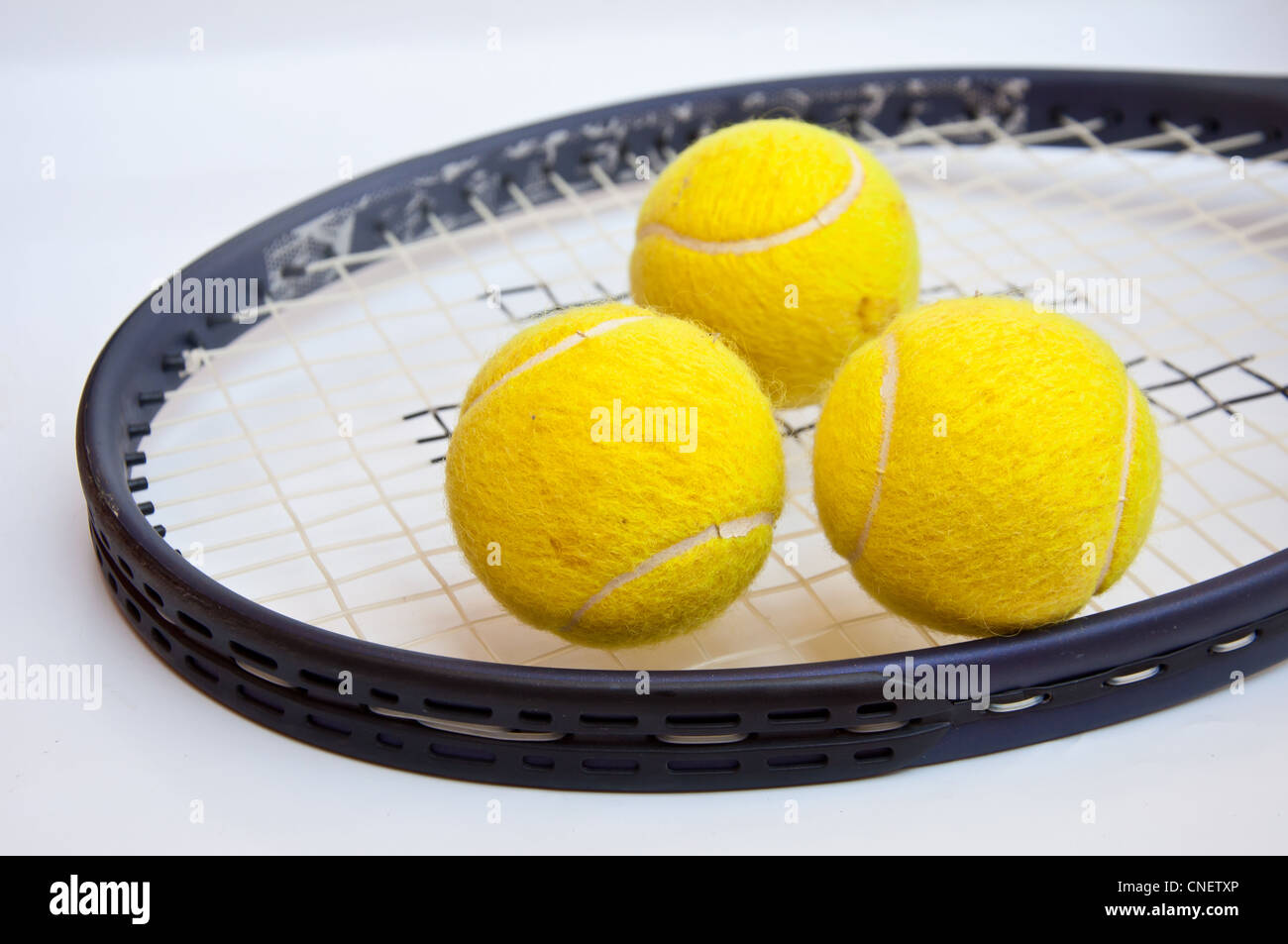 tennis ball on racket Stock Photo - Alamy