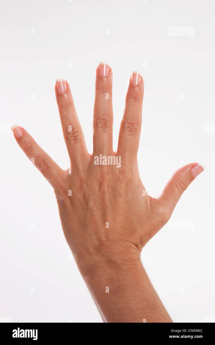 Young female extended hand Stock Photo - Alamy