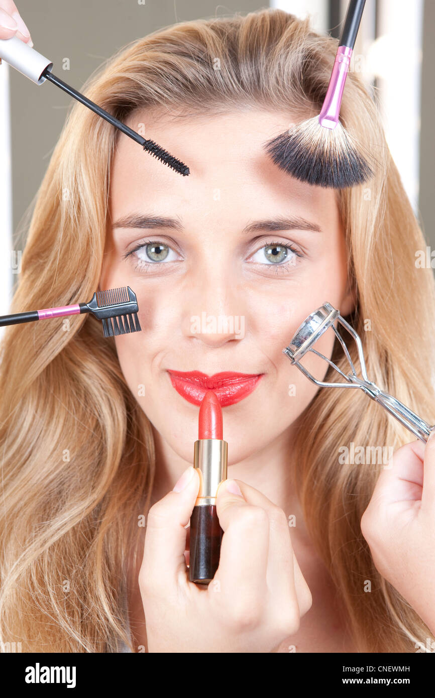 Woman being made up red hi-res stock photography and images - Alamy