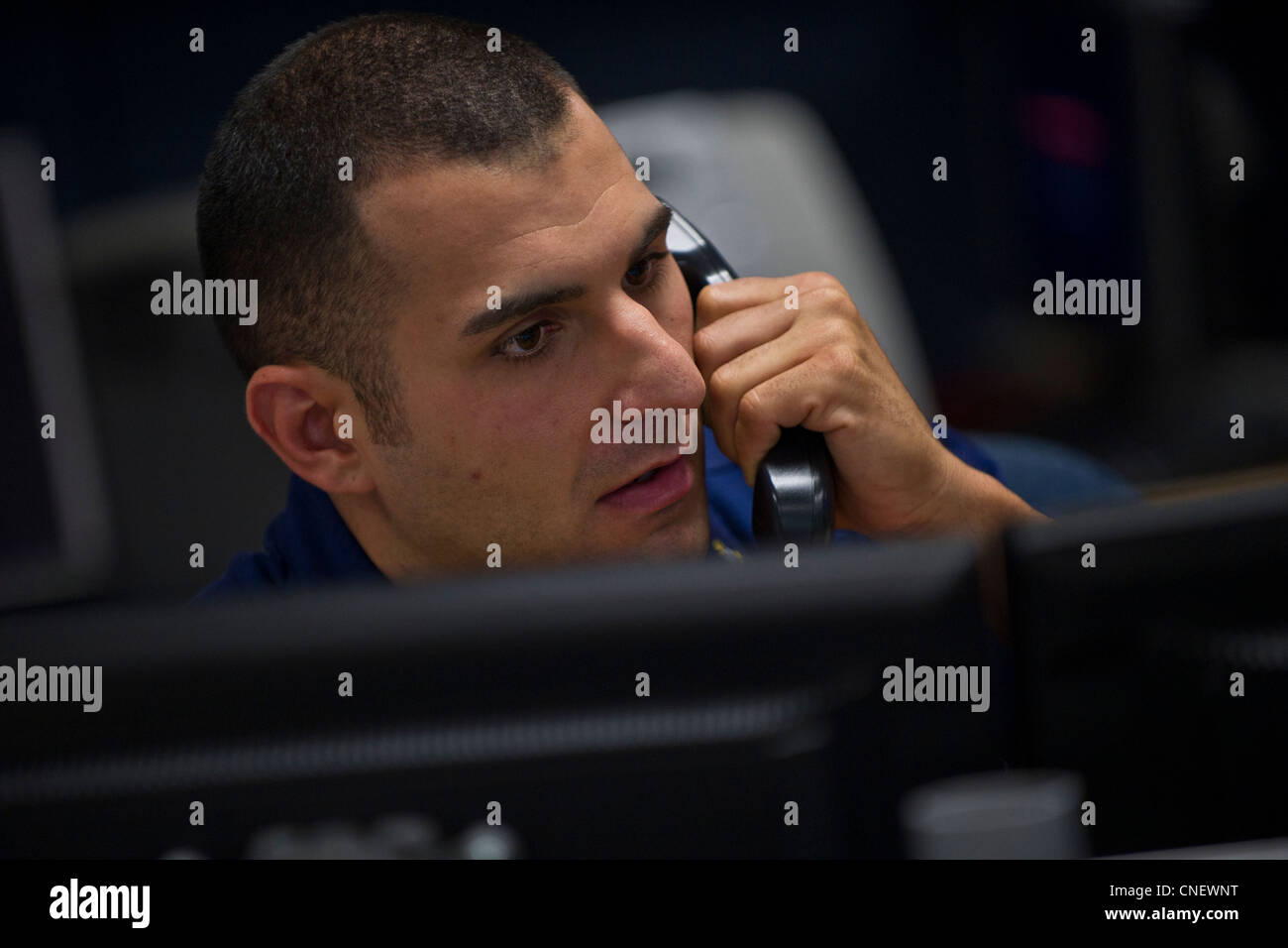 U.S. Coast Guard Operations Specialist Chief John Colella responds to a ...