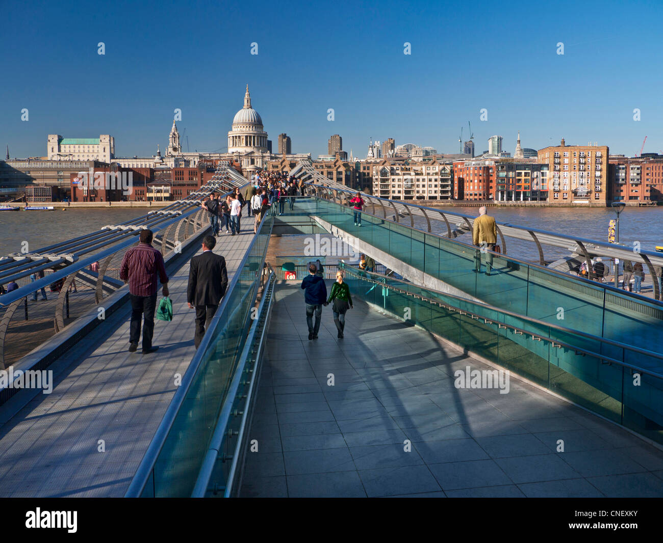 Millennium Bridge with visitors in crisp clear sunshine with St Paul's ...