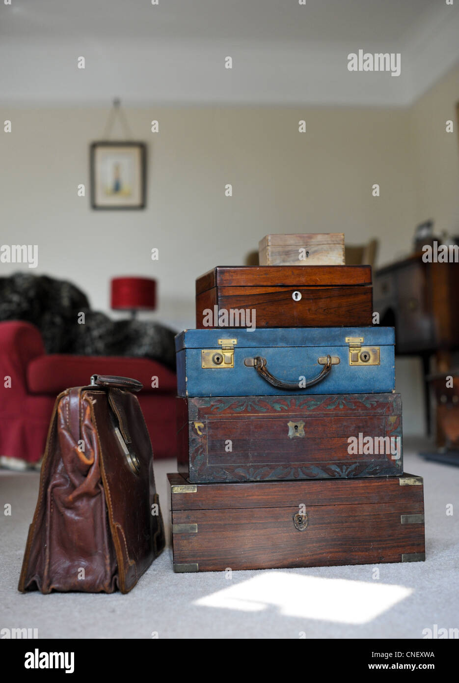Four antique wooden boxes, an old battered leather brief case and a ...