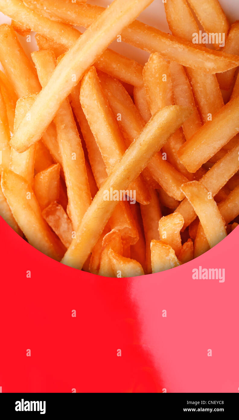 Deep fried potato snack - french fries closeup in a red box Stock Photo ...