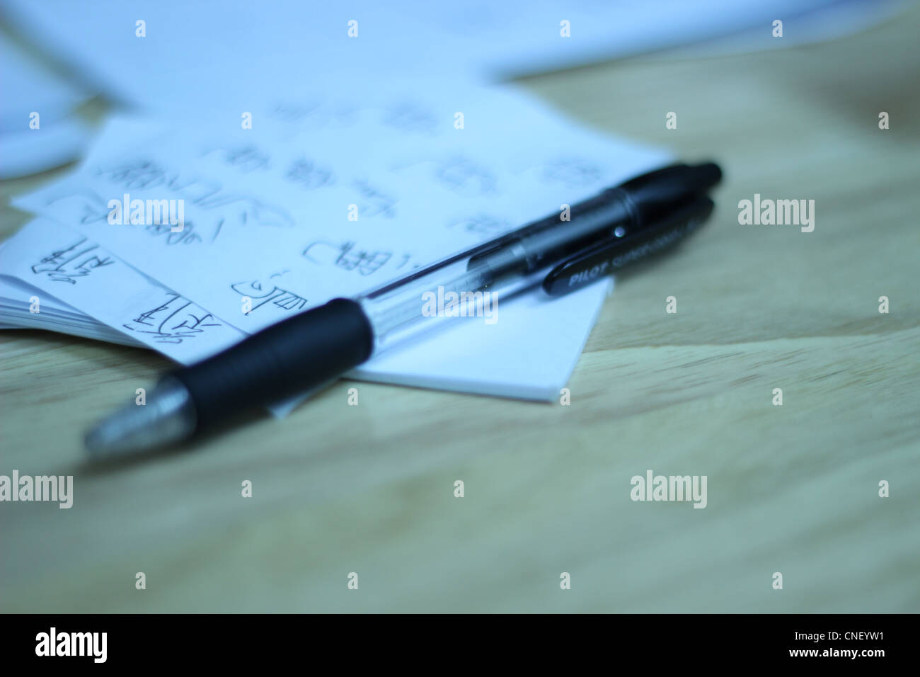 pieces of paper full of Chinese writing and a pen Stock Photo - Alamy