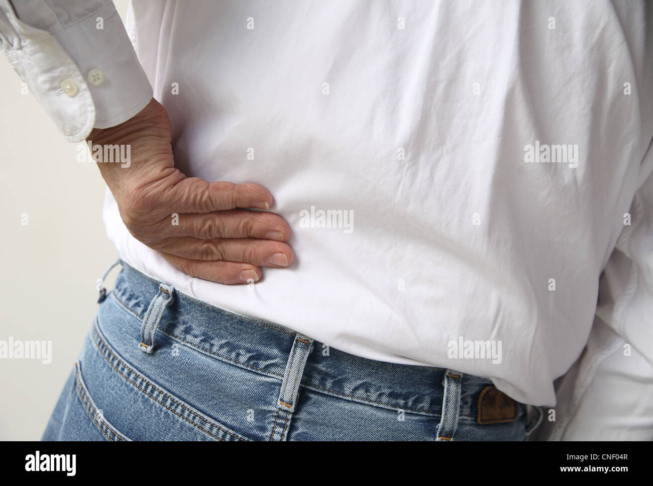 man suffering from a backache Stock Photo - Alamy