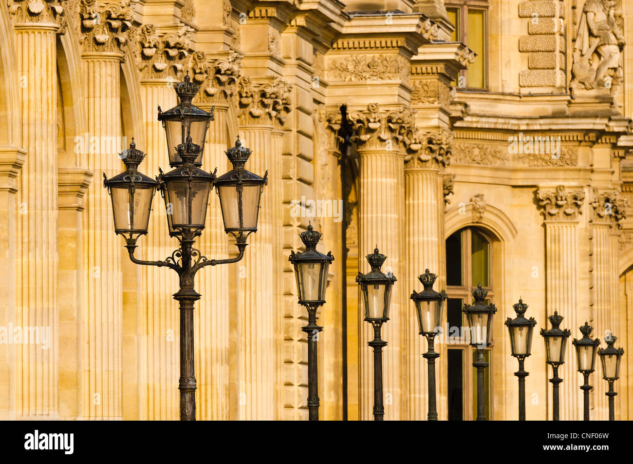 Lamp posts and columns at the Louvre Palace, Louvre Museum, Paris ...