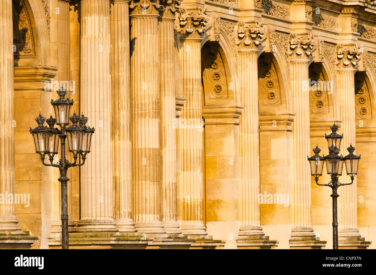 Lamp posts and columns at the Louvre Palace, Louvre Museum, Paris ...