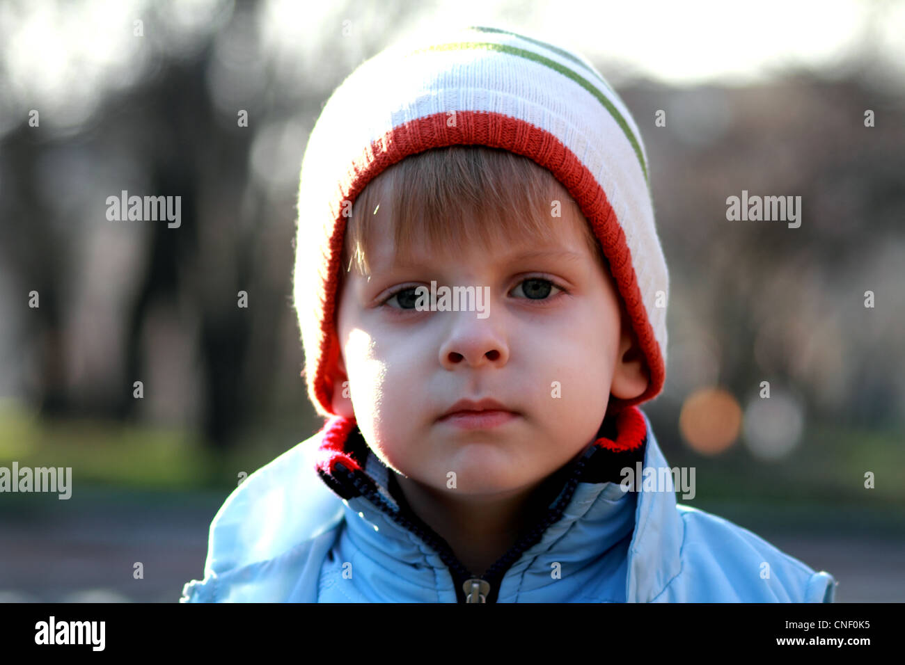 cute blue eyes boy in blue jacket Stock Photo - Alamy