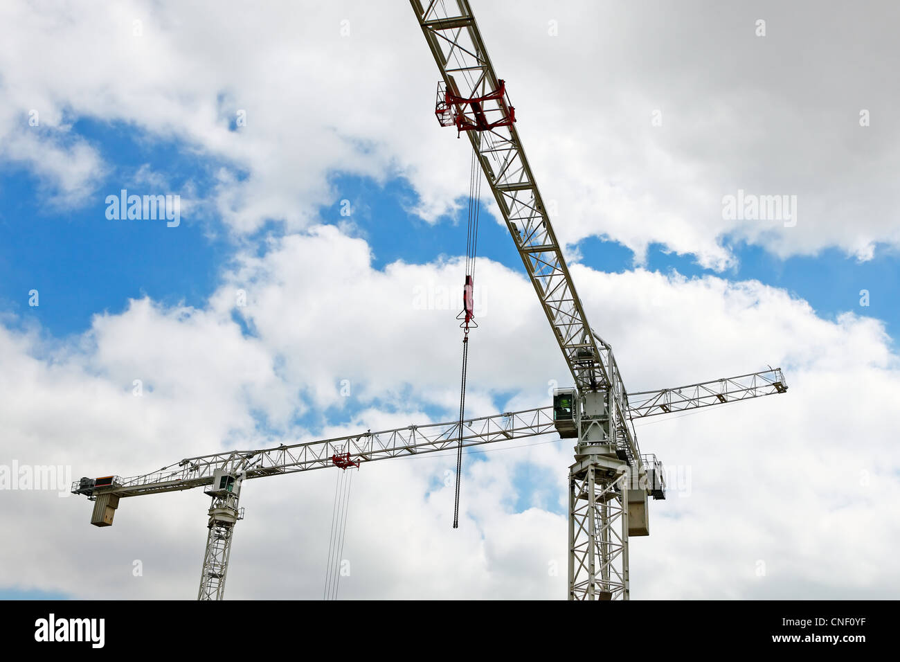 Hoisting crane on blue sky Stock Photo - Alamy