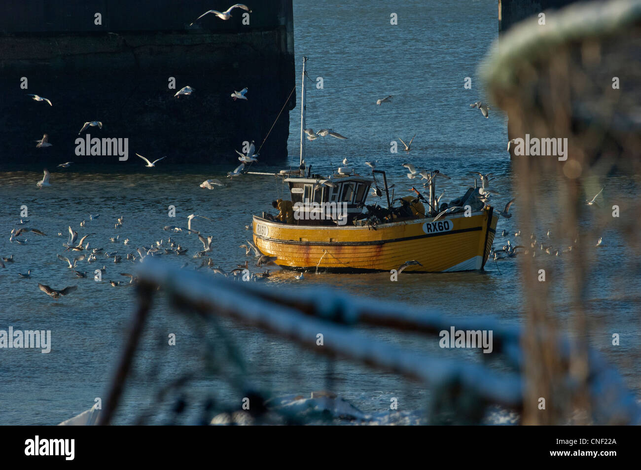 Hastings fishermen landing their catch at The Stade. Old Town harbour ...
