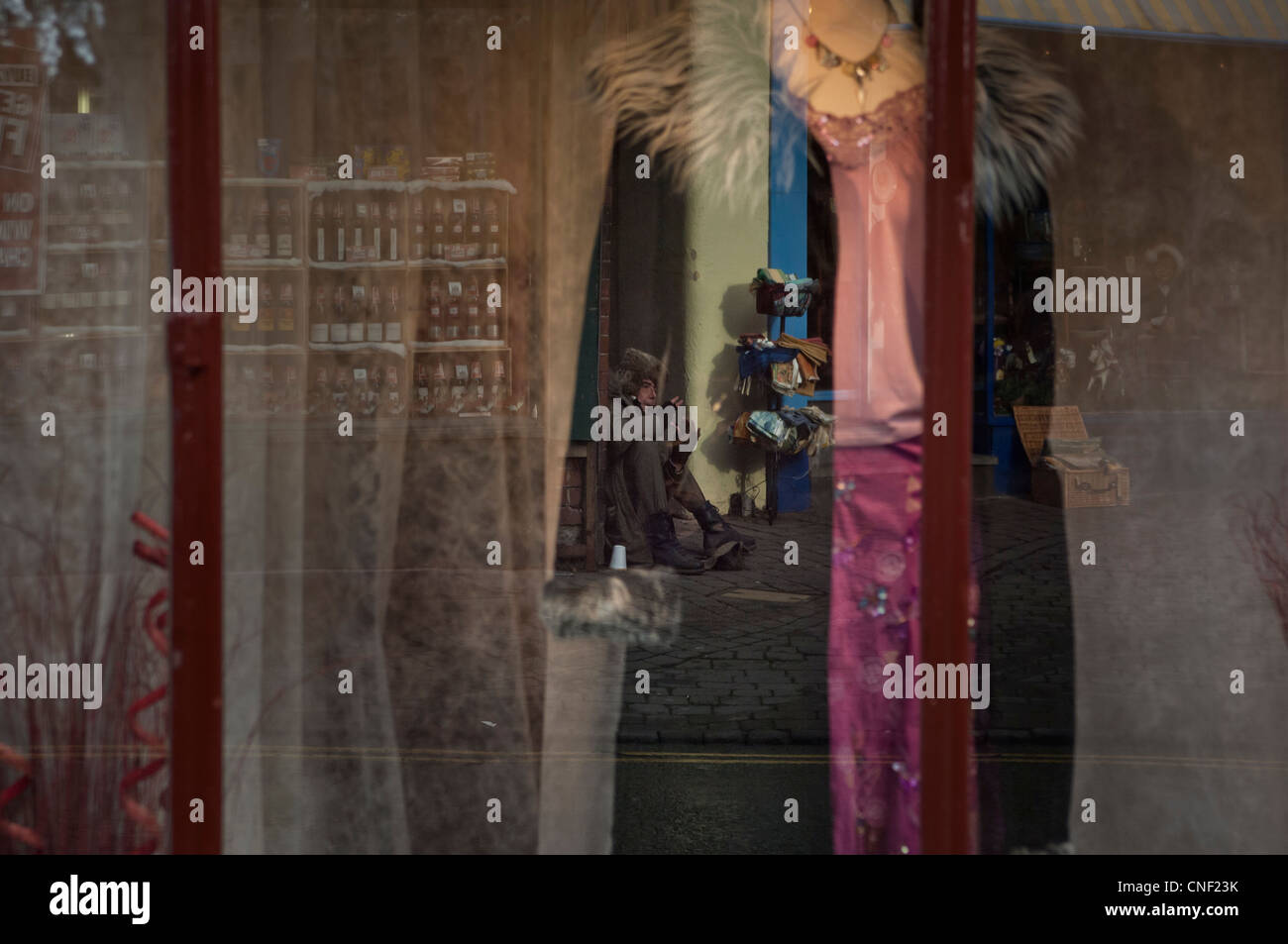 Homeless man outside shop hi-res stock photography and images - Alamy