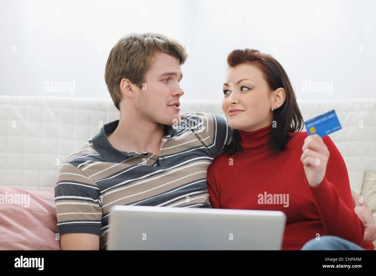 Young couple making online purchases Stock Photo - Alamy