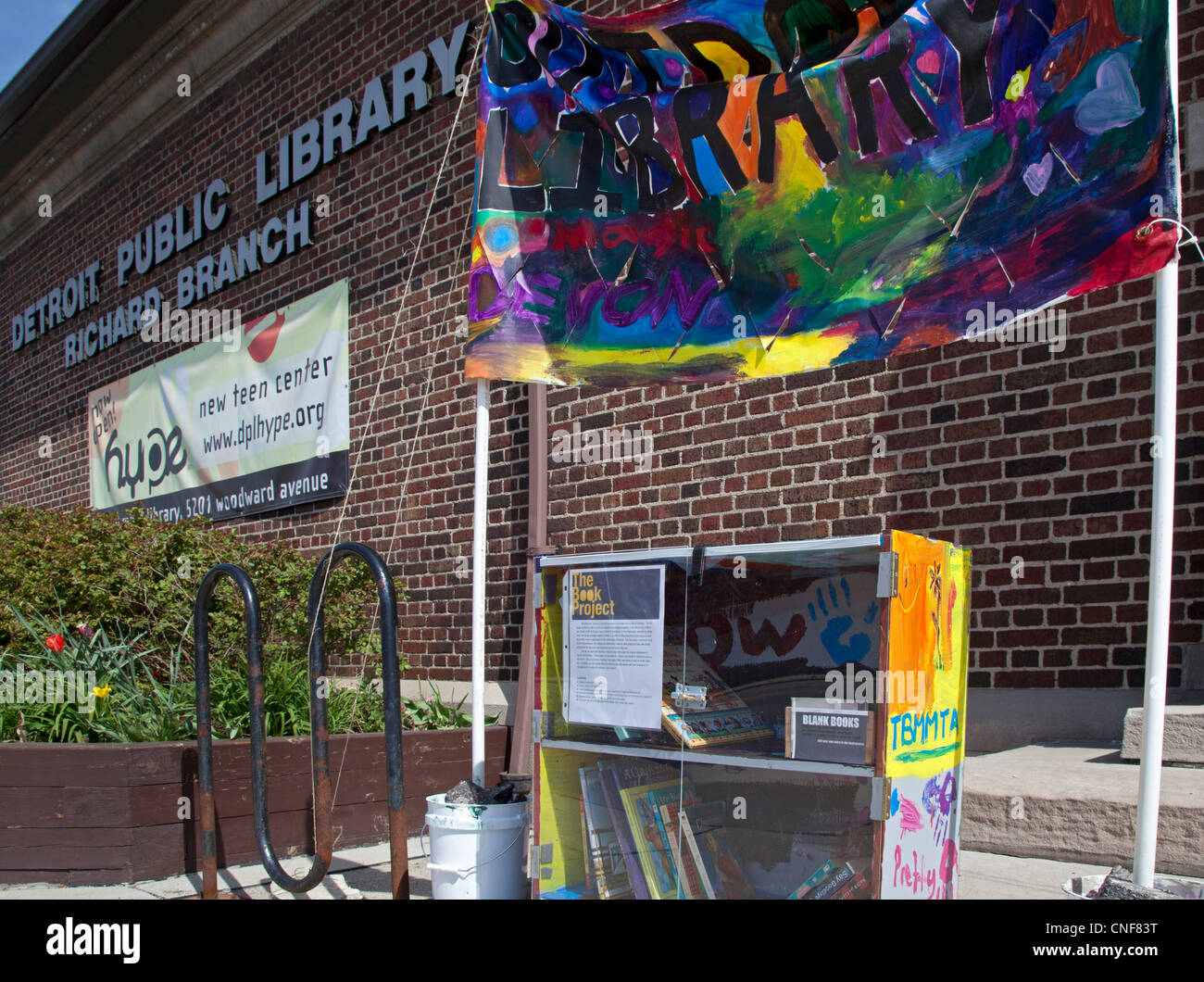 Tiny outdoor free library outside a Detroit library branch closed due ...