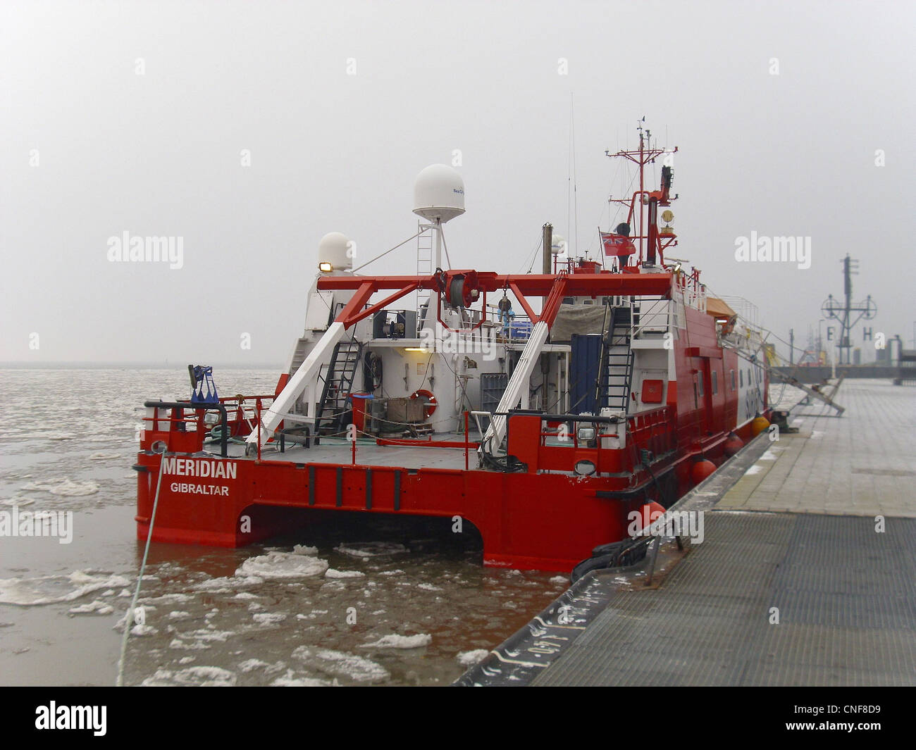 The survey vessel Meridian is shown from the rear as it docks in ...