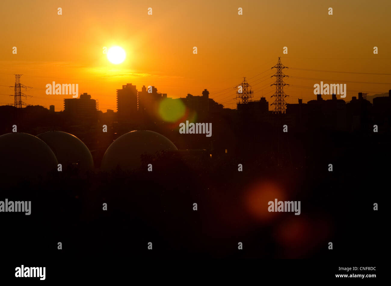 Sunset over Toyonaka in Japan with power poles and skyscrapers Stock ...