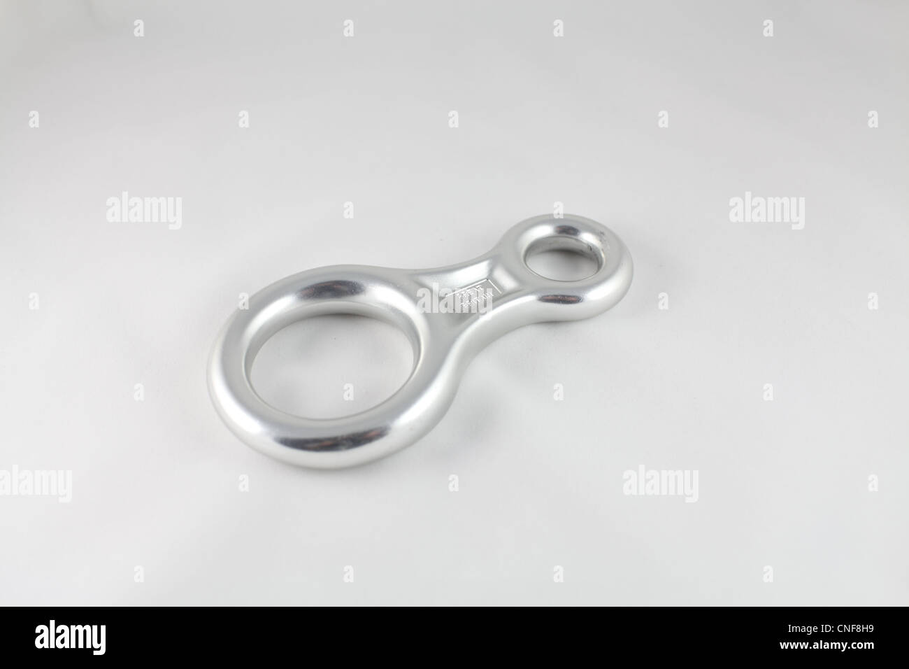 Silver climbing descender for abseiling Stock Photo - Alamy