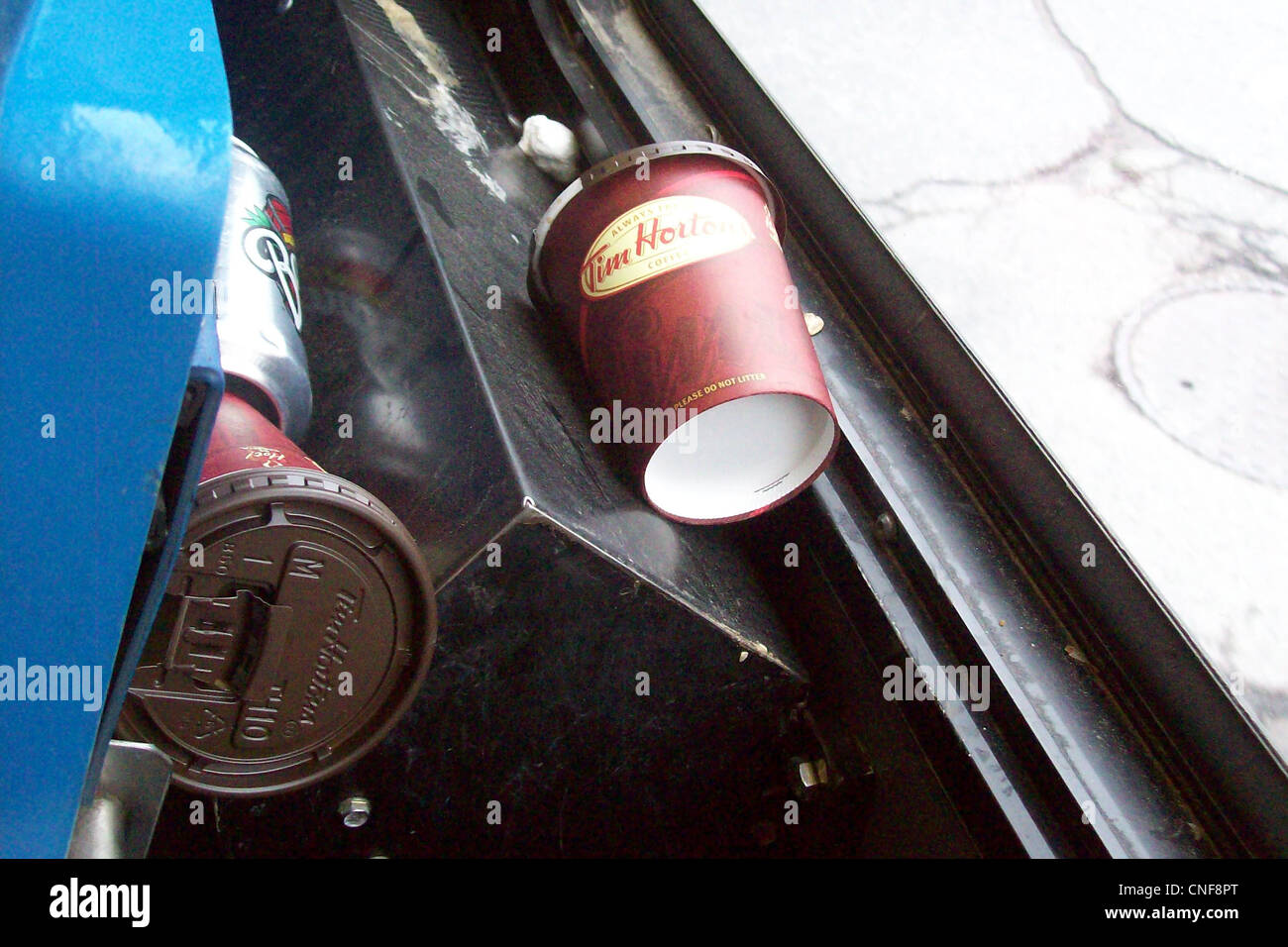 An image showing discarded trash and rubbish on a bus, highlighting an ...