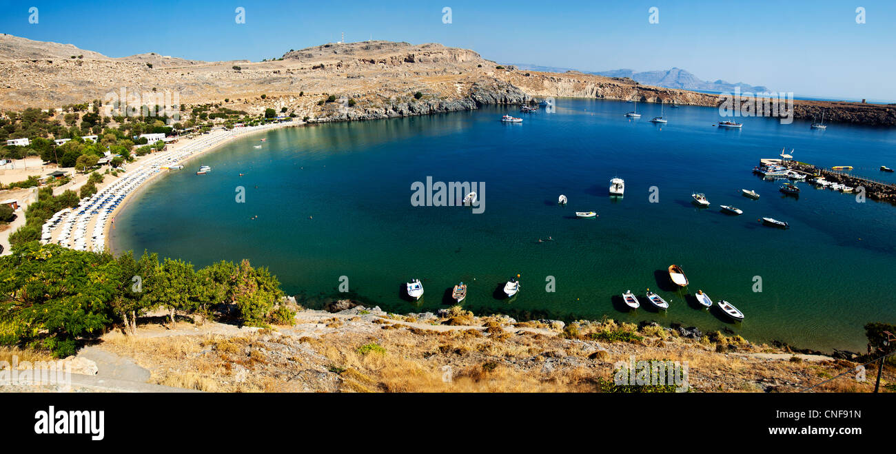 Colorful panorama of Lindos bay on Rhodes island. Greece during summer ...