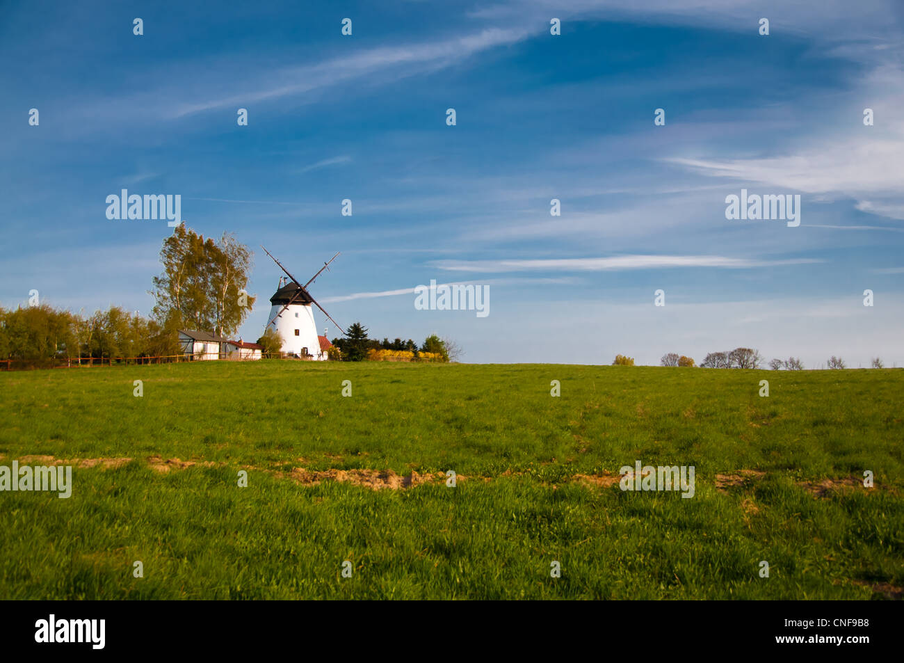 white windmill on farm field Stock Photo - Alamy