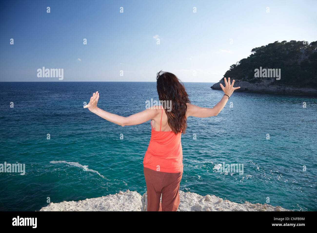 woman on red at Menorca island in Spain Stock Photo - Alamy