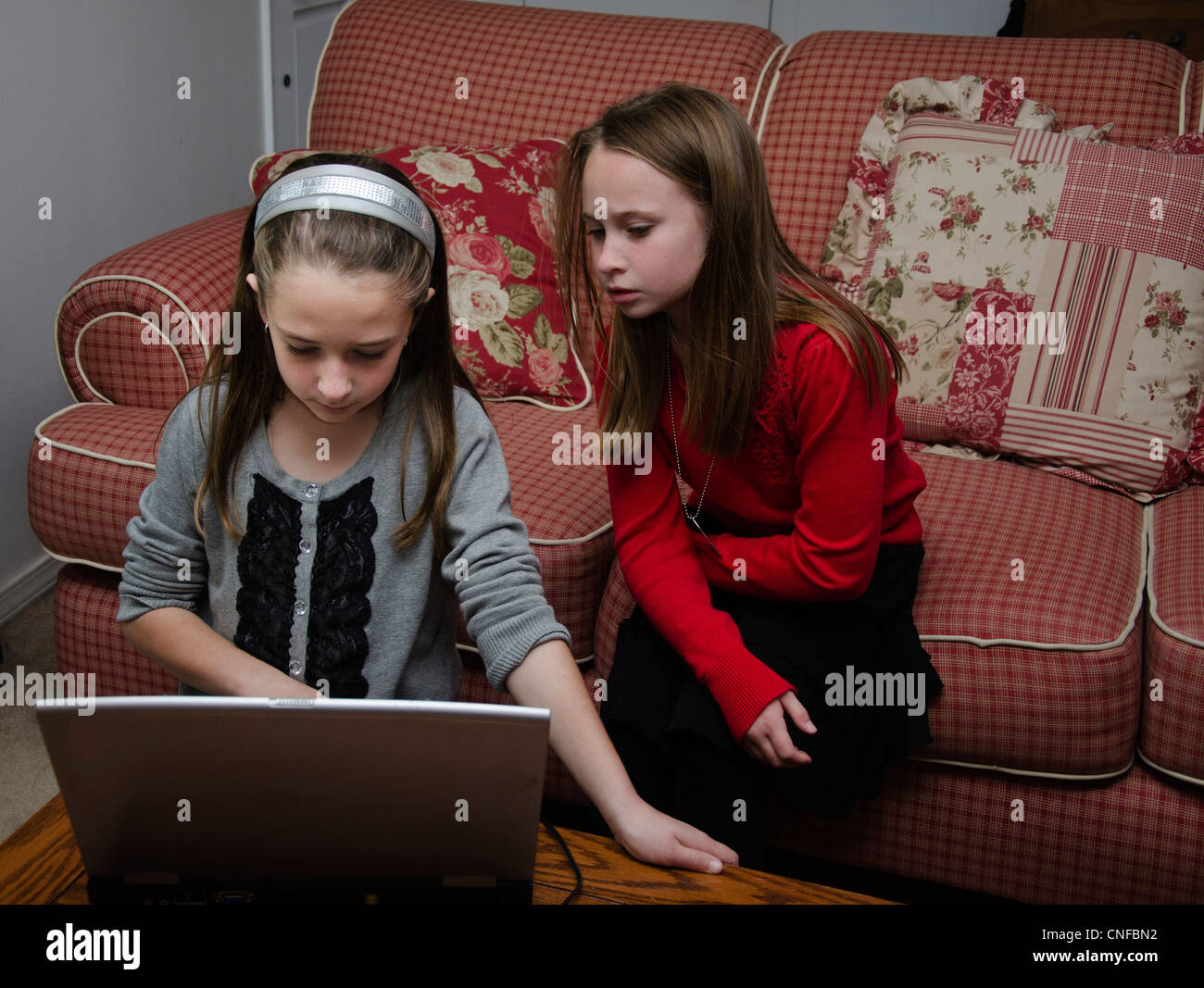 Younger sister with her homework, hi-res stock photography and images ...