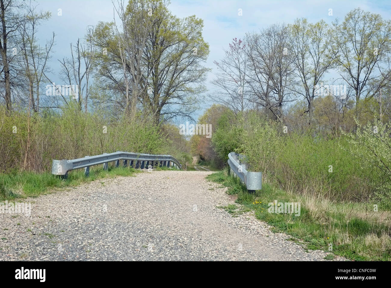 Bridge and country lane Stock Photo - Alamy