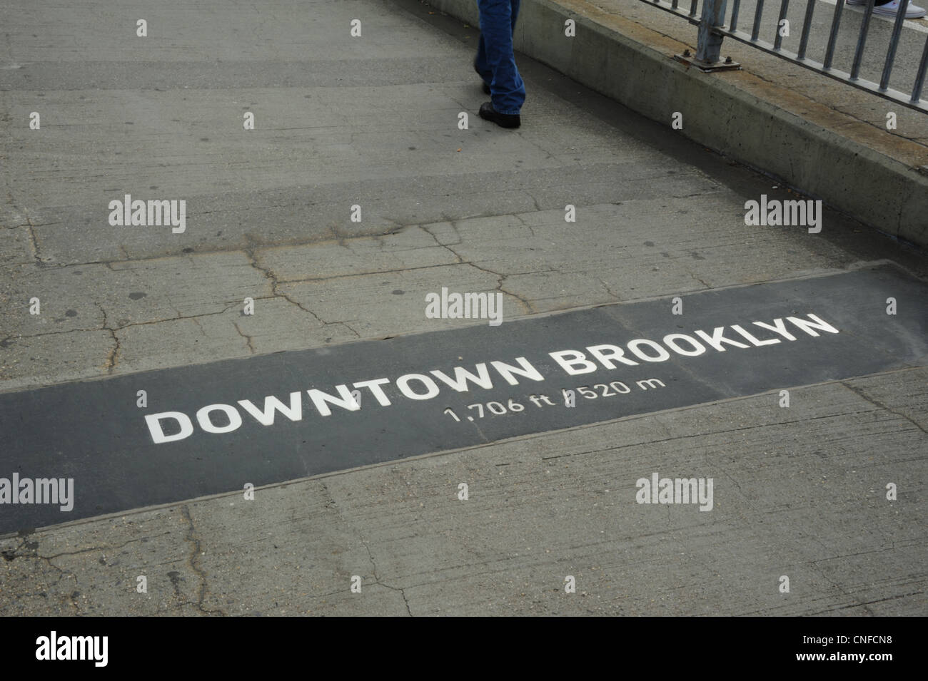 'Downtown Brooklyn 1706ft/620m' metal plaque sign inset in surface ...