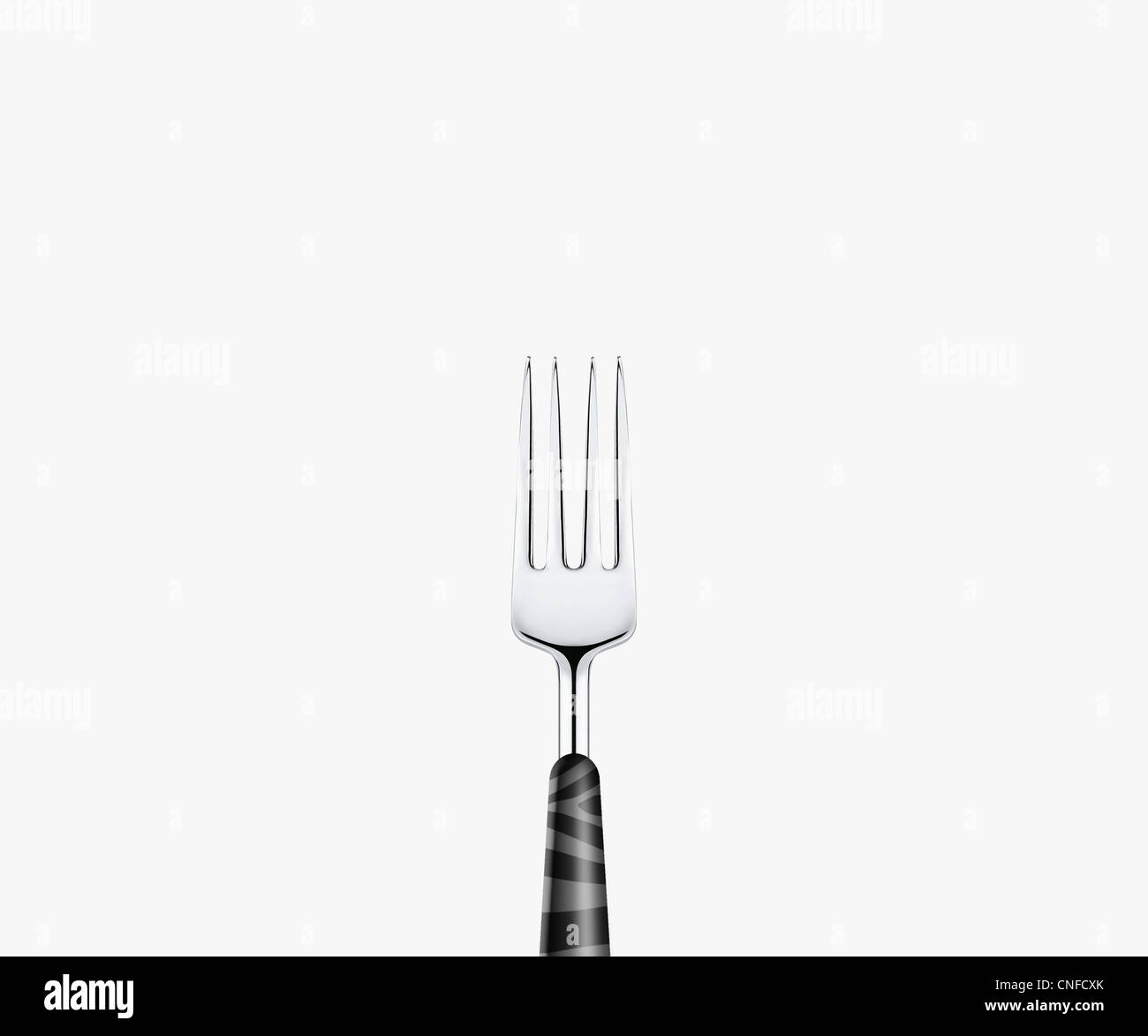 Sharp metal fork on white background Stock Photo - Alamy