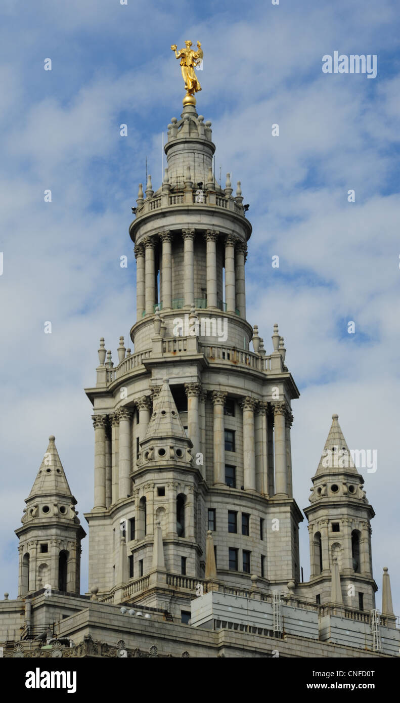 Blue sky view gold statue Civic Fame rising top neo-classical columns ...